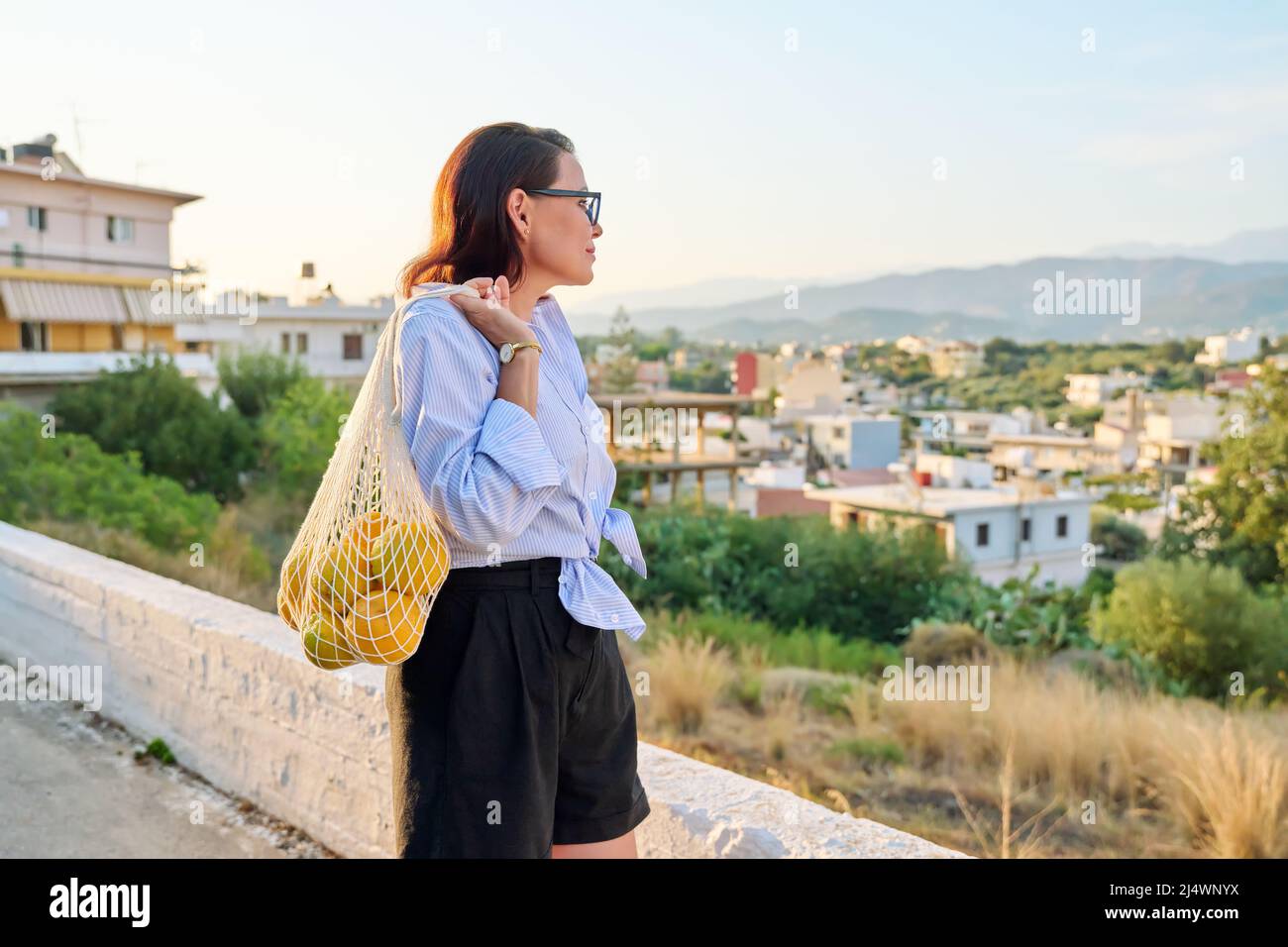 Eco tourism, woman walking relaxing in European mountain village Stock ...