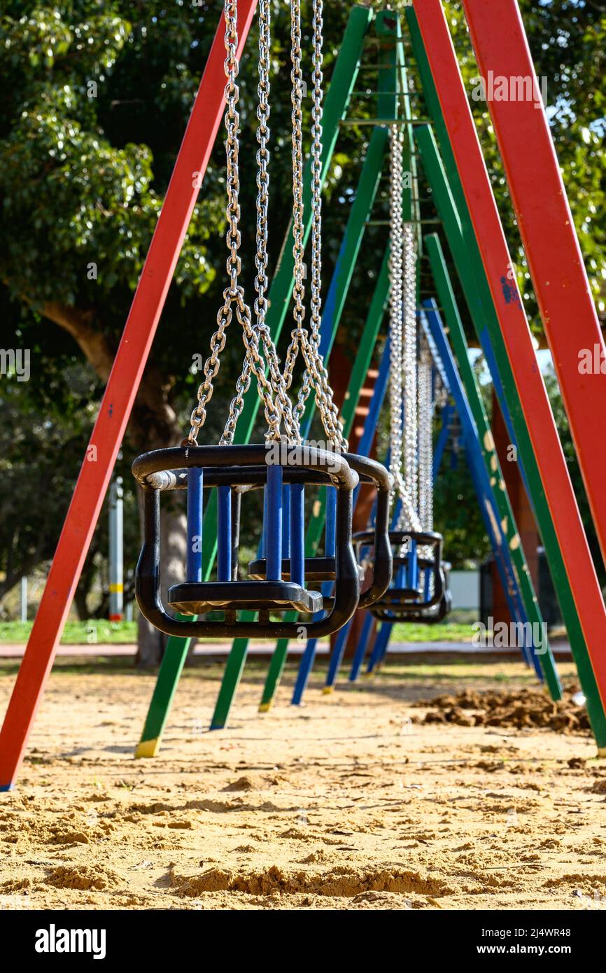 swings on chains on the playground in the park. close-up Stock Photo ...