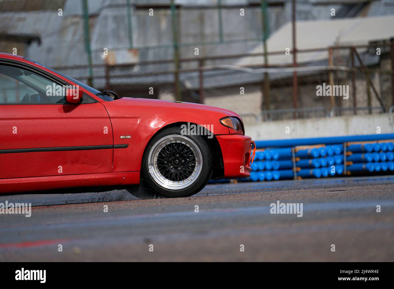 front part of red car. Front wheel of car Stock Photo - Alamy