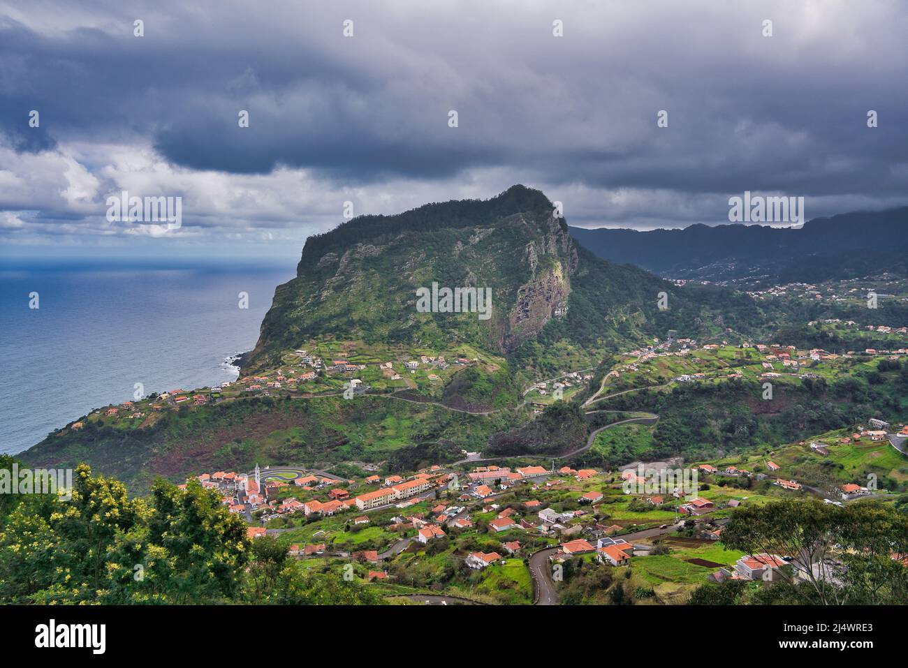 A beautiful scenic view of the coast and mountains of Madeira. Clouds ...
