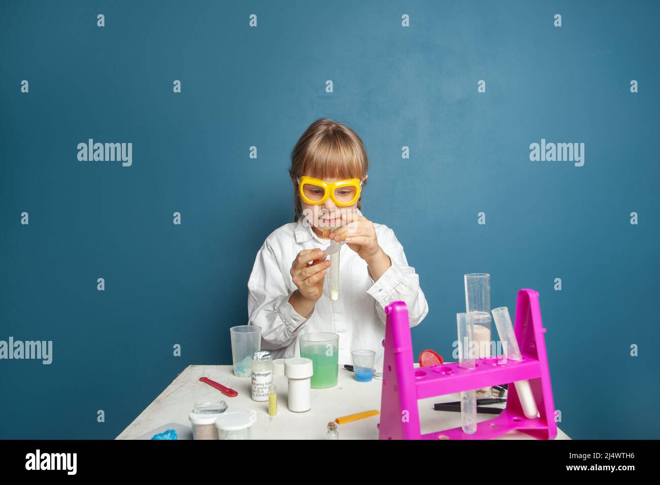 Cute little girl in a science lab. Child science concept Stock Photo ...