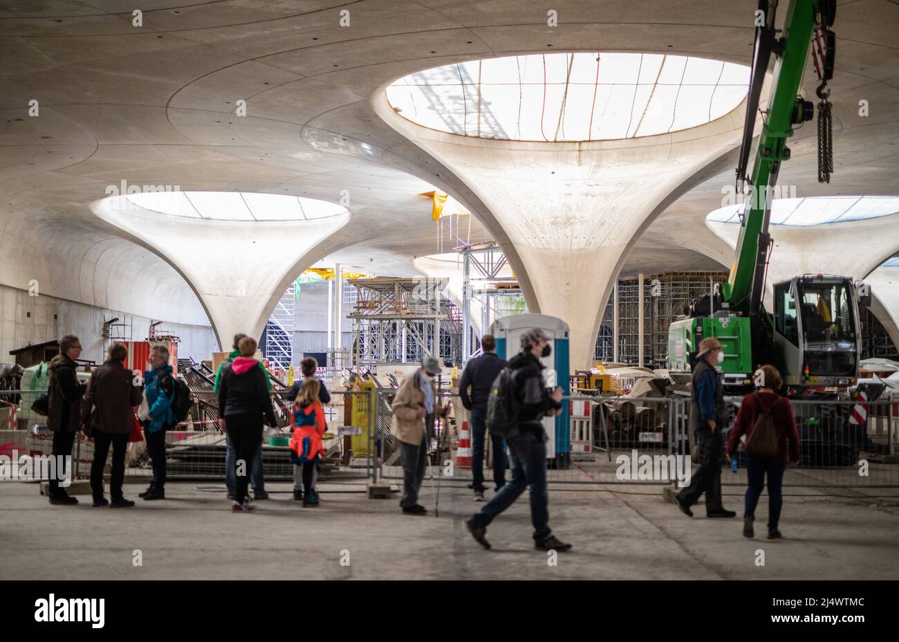 Stuttgart, Germany. 18th Apr, 2022. Visitors look around the construction site of the Stuttgart ...