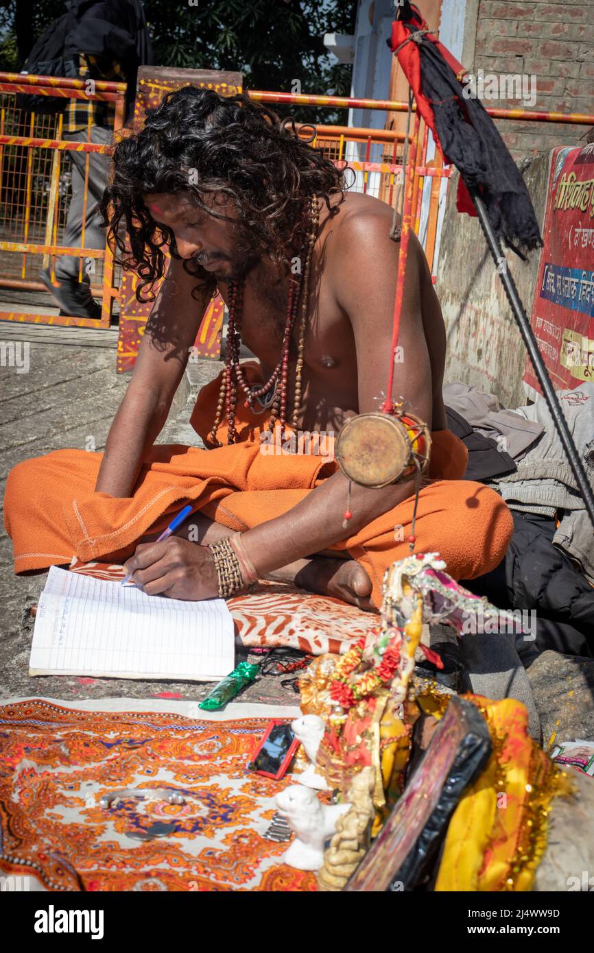 indian saints writing on paper at day from flat angle image is taken at ...