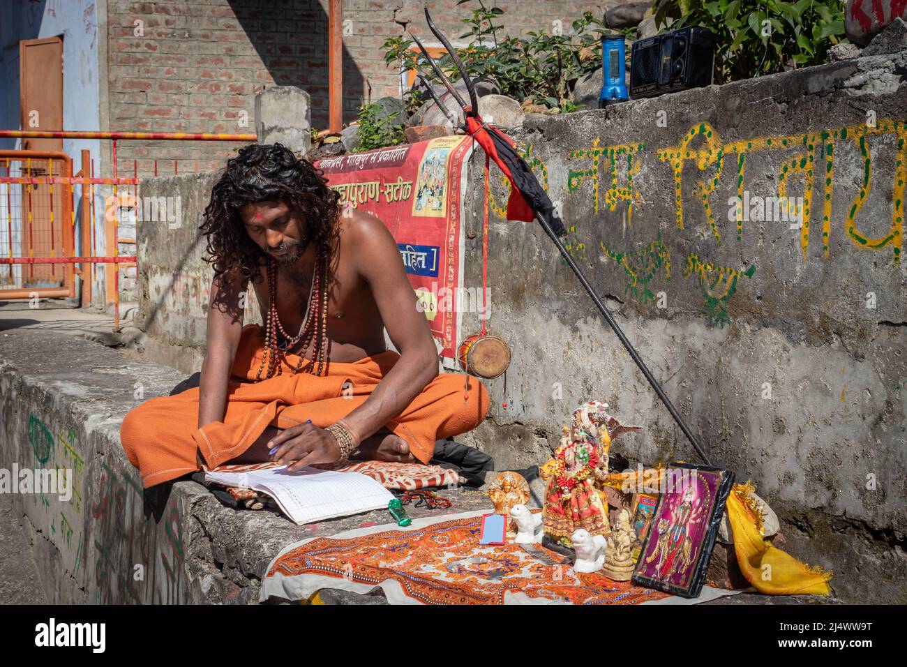 indian saints writing on paper at day from flat angle image is taken at ...