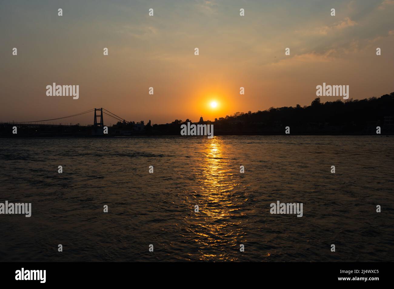 sunset orange sky over flowing river horizon at evening from flat angle ...