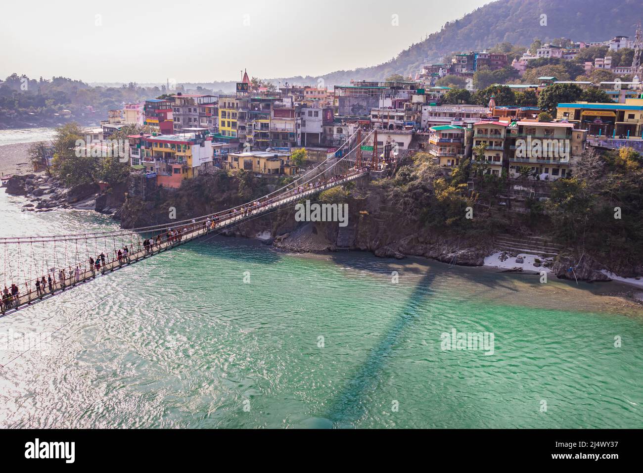 lakshman jhula iron suspension bridge over ganges river from flat angle ...