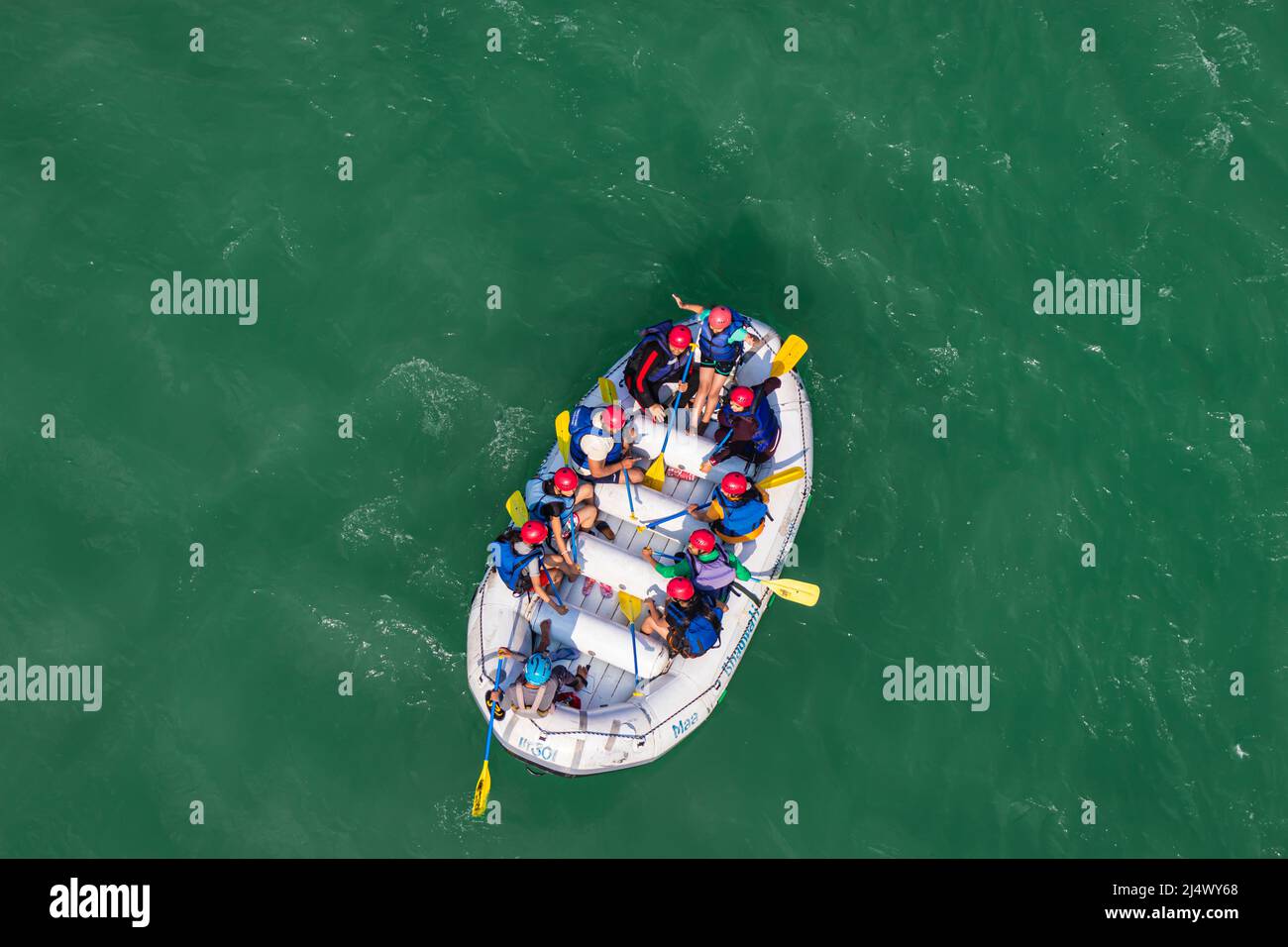 raft boat with people at the middle of ganges river from top angle ...