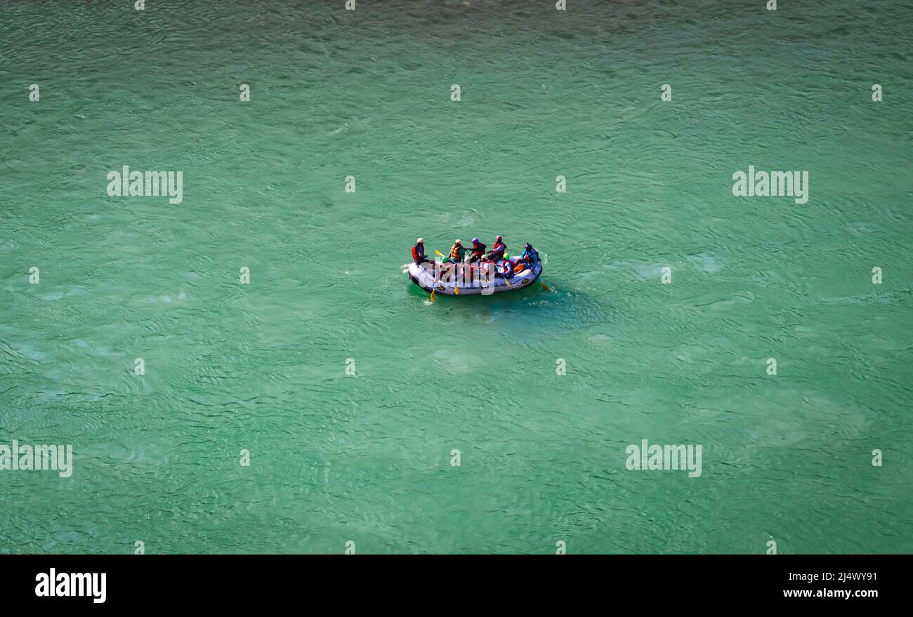 raft boat with people at the middle of ganges river from top angle ...