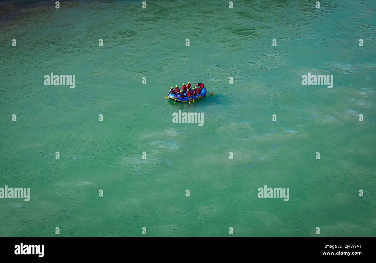 raft boat with people at the middle of ganges river from top angle ...