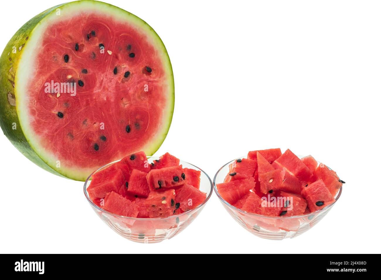 Close up view of whole and two plates of diced watermelon isolated on ...