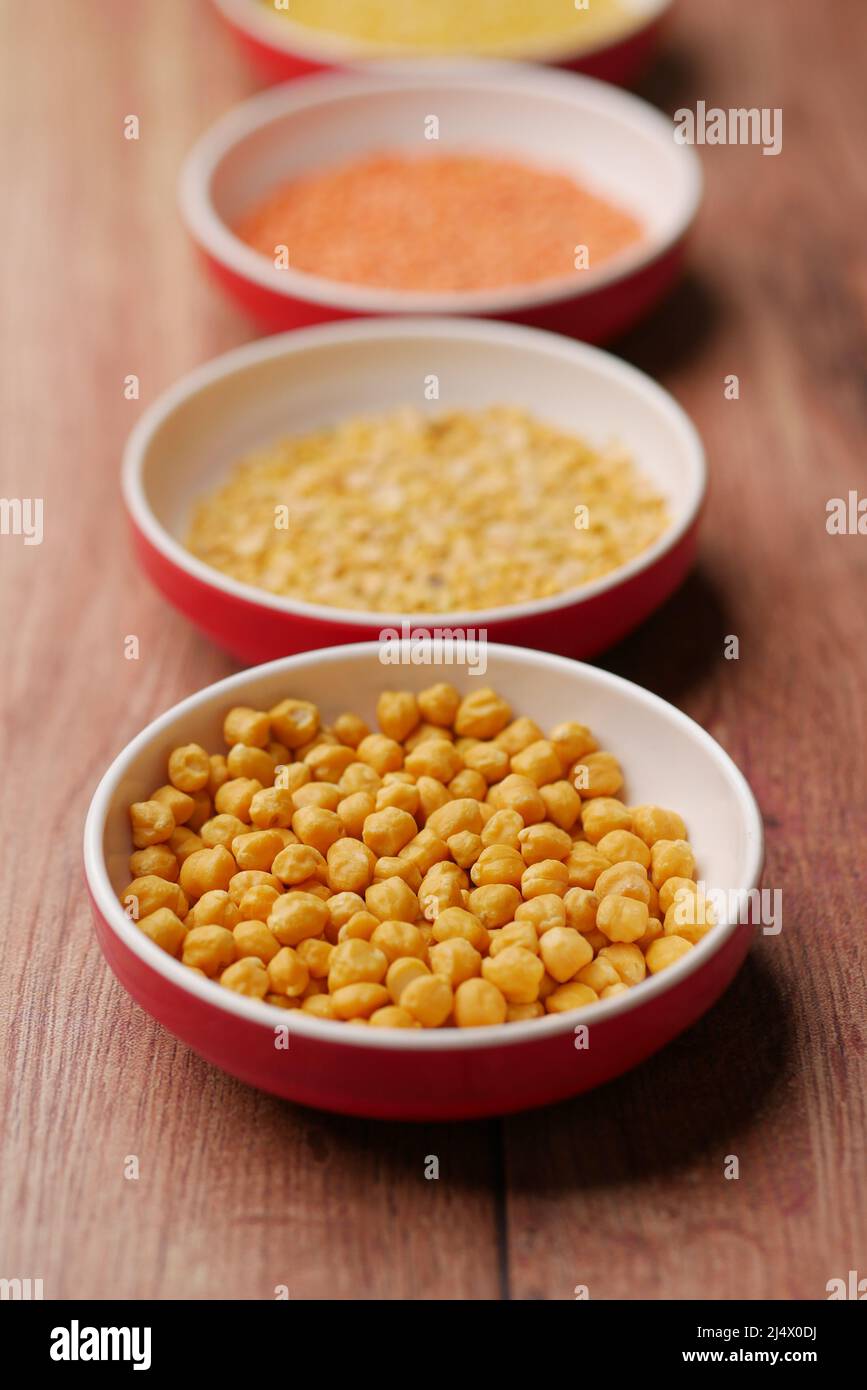 Bowl of uncooked dhal on table top view Stock Photo - Alamy