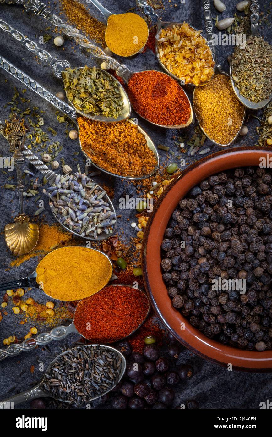 Selection of spices used to add flavor and seasoning to food during ...