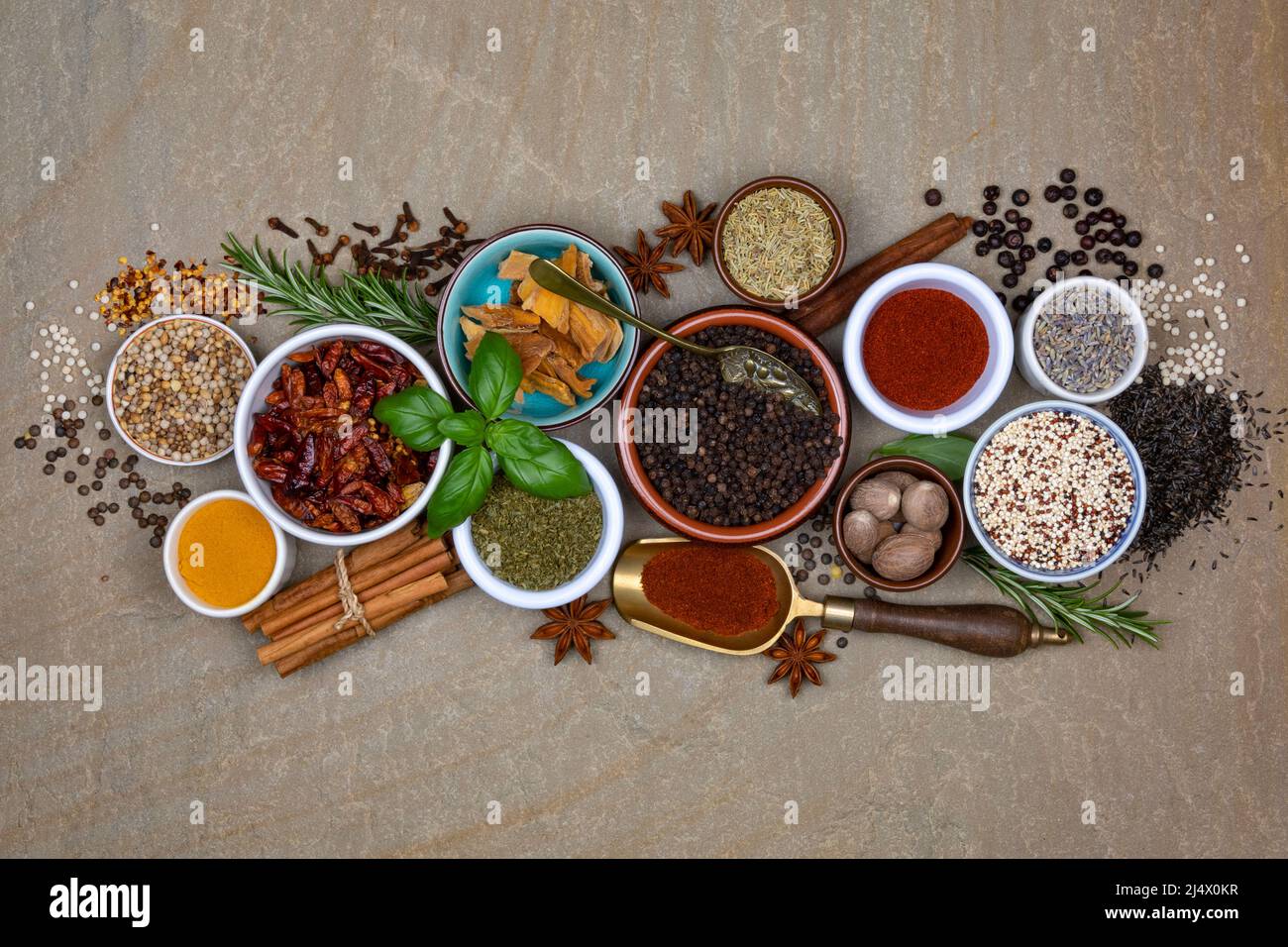 Selection of spices and herbs used to add flavor and seasoning to food ...