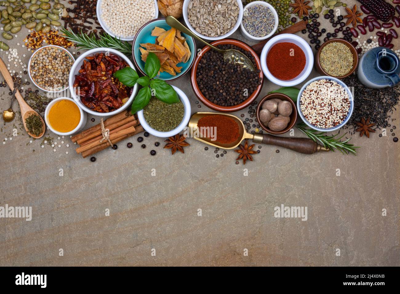 Selection of spices and herbs used to add flavor and seasoning to food ...