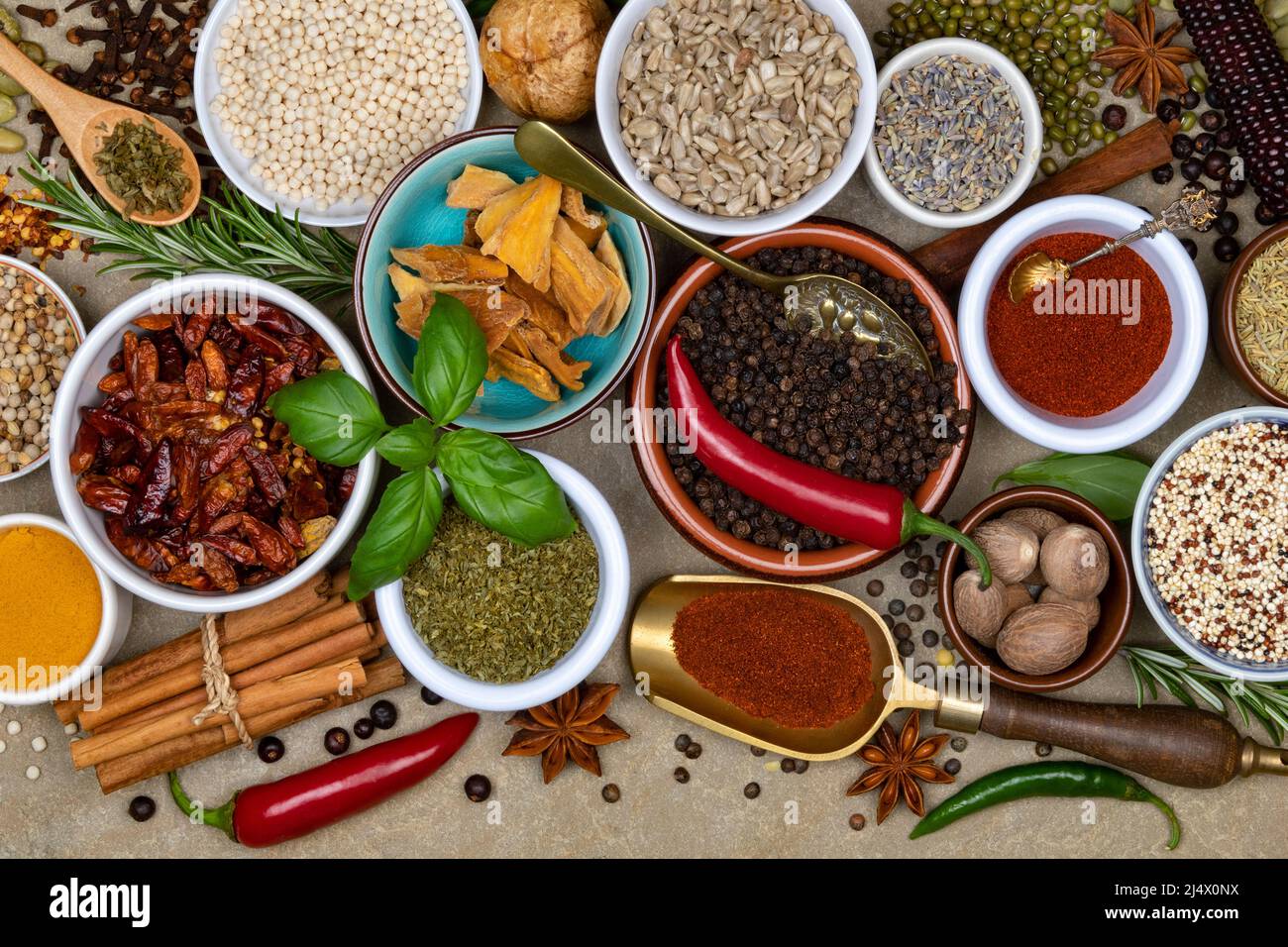 Selection of spices and herbs used to add flavor and seasoning to food ...