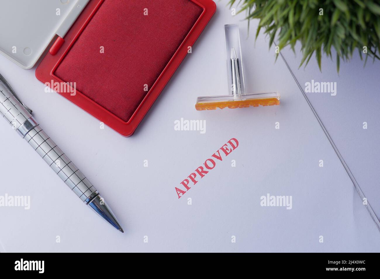 Stamping Document with Approving Contract close up Stock Photo - Alamy