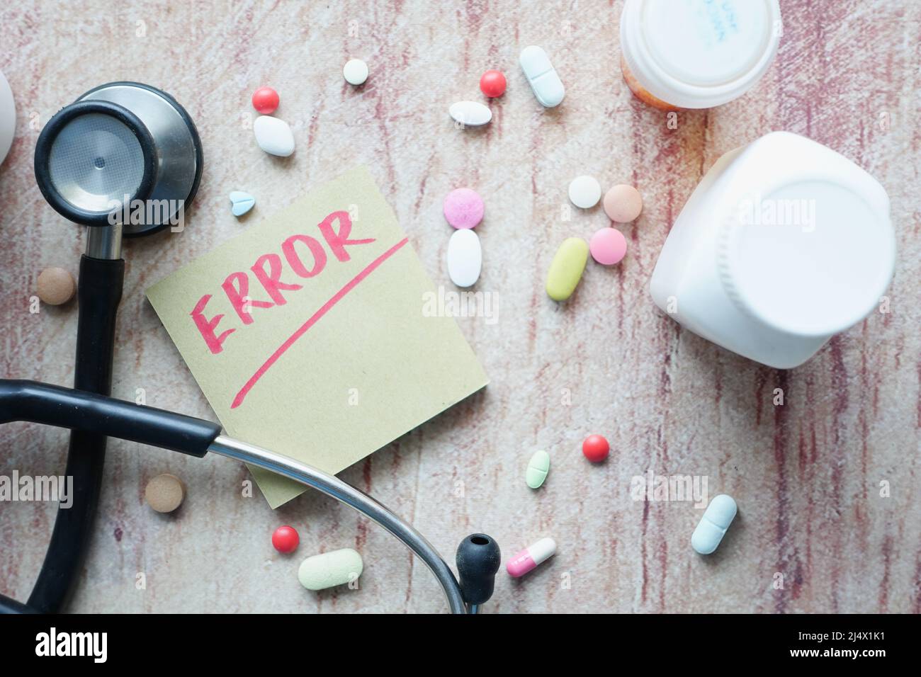 medical error text on a paper with pills and stethoscope on table Stock ...