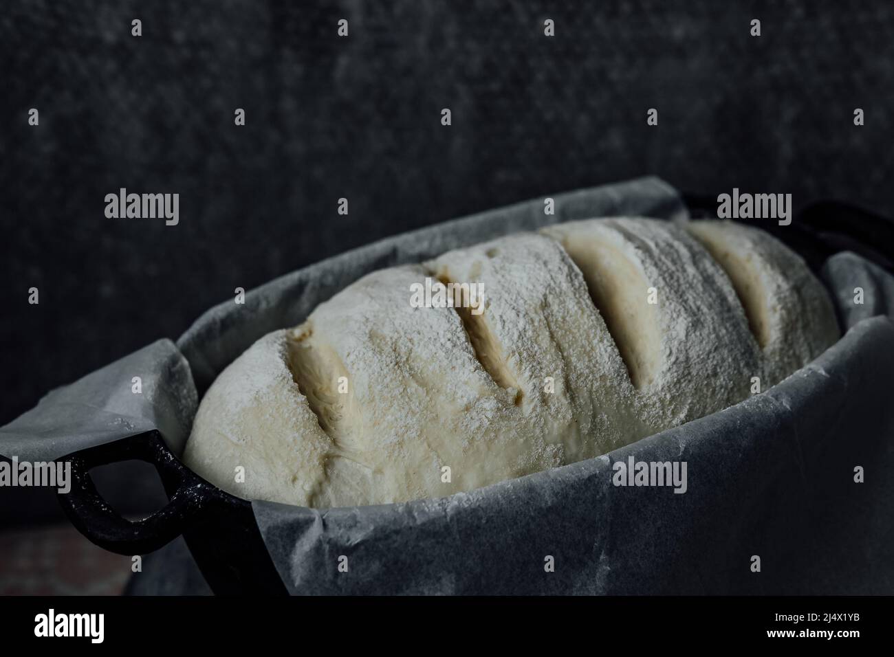 Raw bread dough in the mold ready for baking Stock Photo - Alamy