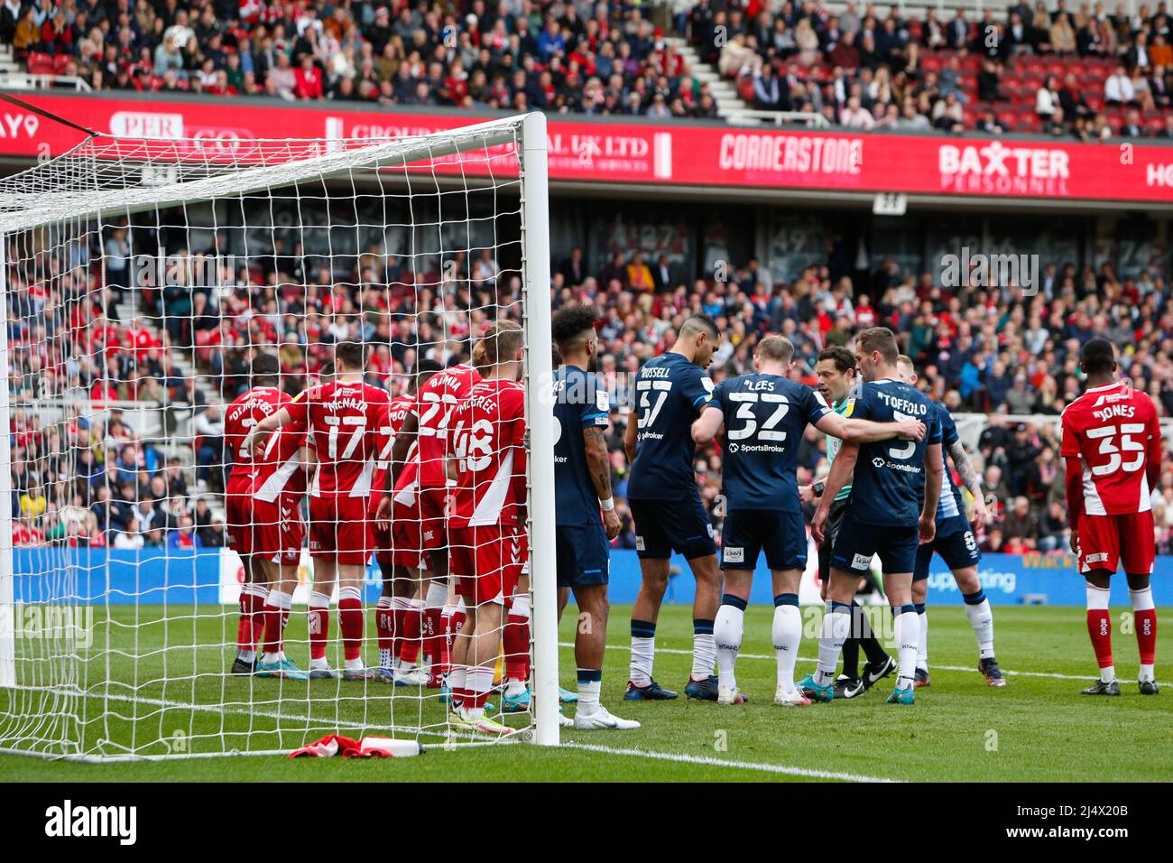 Players of Middlesbrough stand in a line to defend an indirect free ...