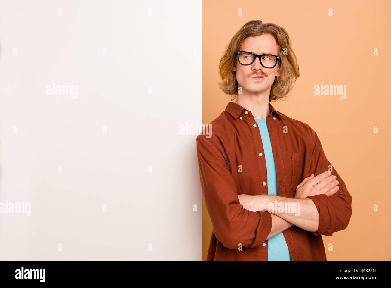 Portrait of attractive minded smart red-haired guy folded arms copy ...