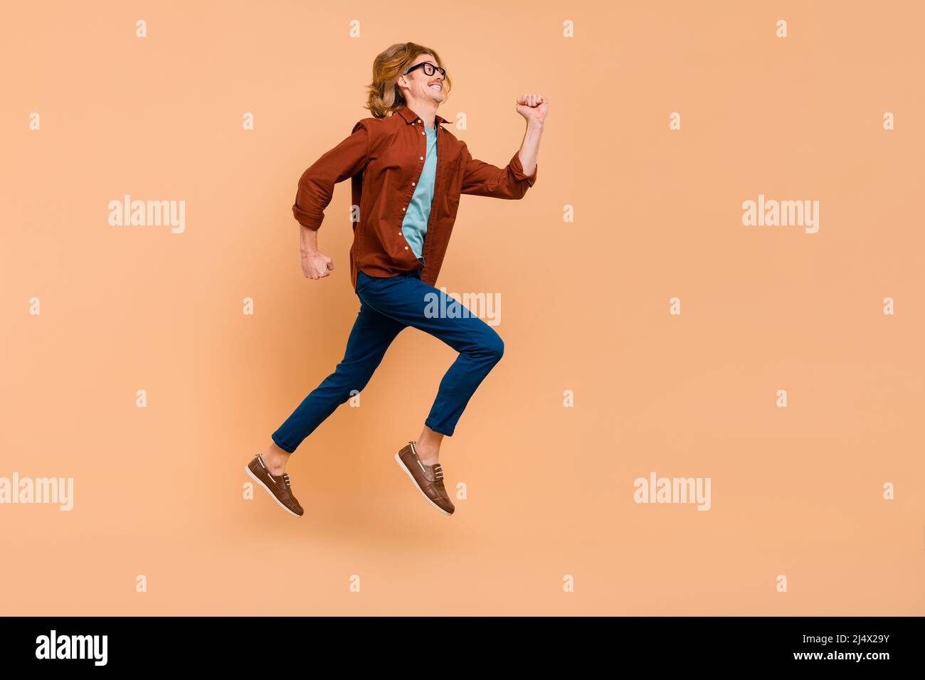 Full length body size view of attractive cheerful anergetic guy jumping ...