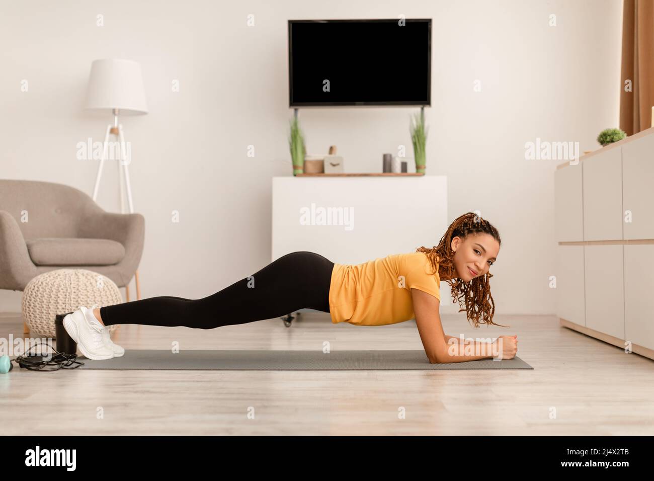 Woman doing plank exercise home hi-res stock photography and images - Alamy