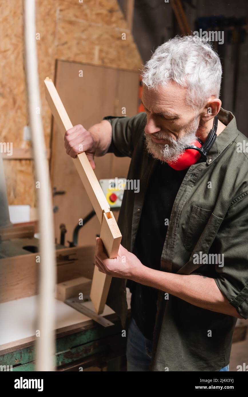 Mature carpenter wooden planks hi-res stock photography and images - Alamy