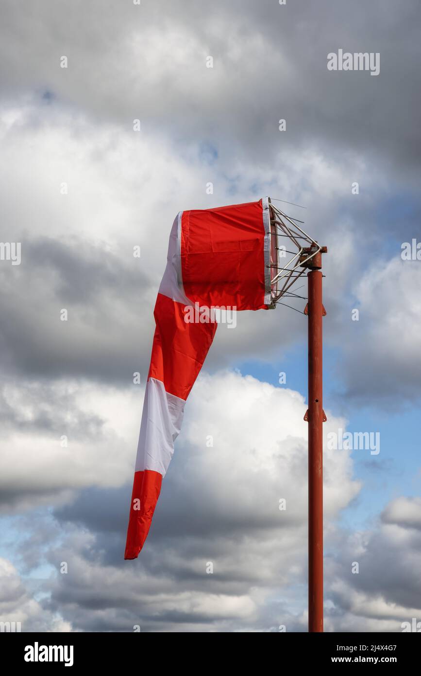 Windsock at an airport with a cloudy sunny sky in background Stock ...