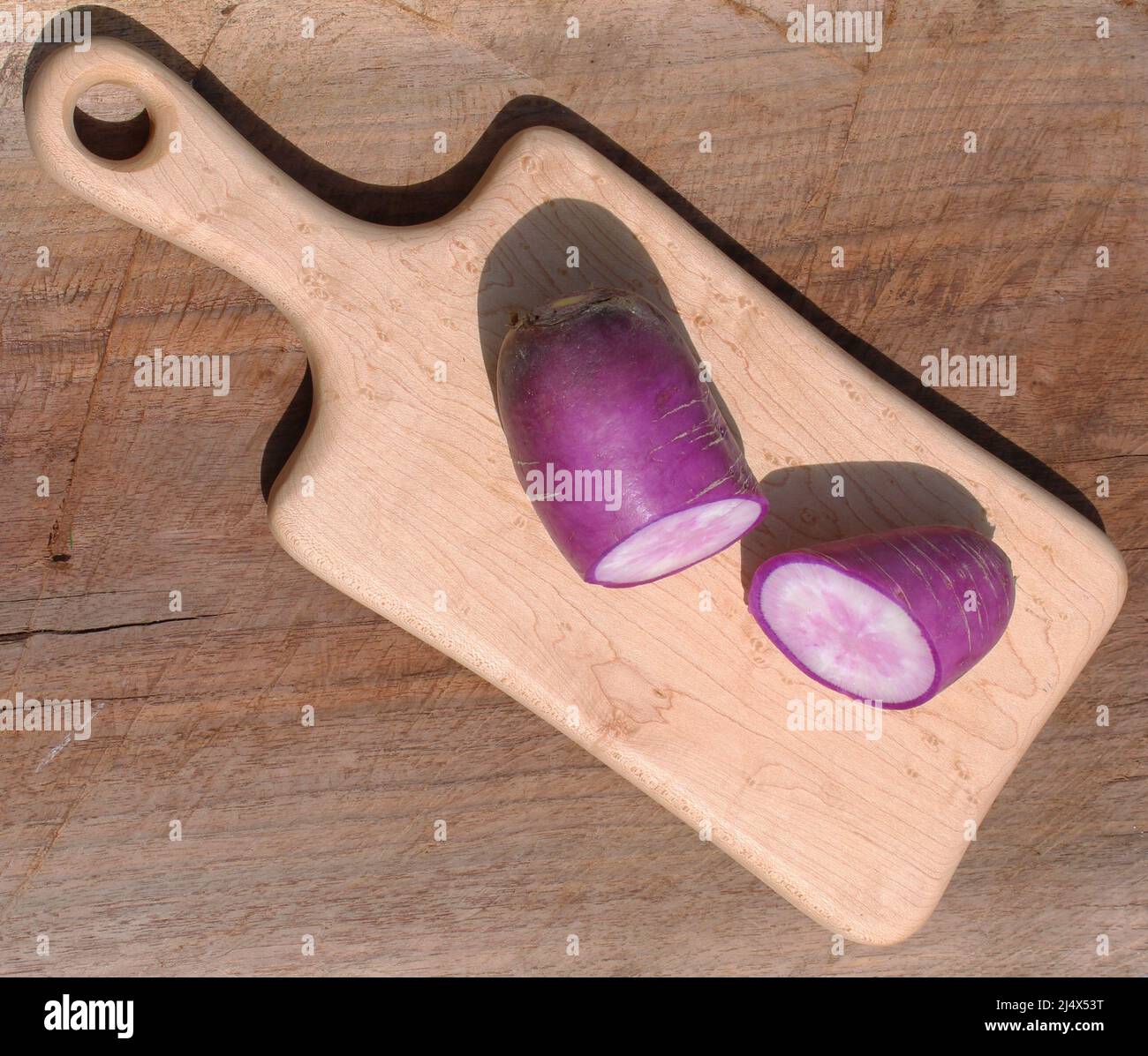 A Purple Ninja Radish Cut in Half Stock Photo - Alamy