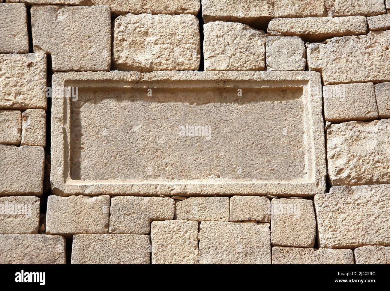 Ancient wall of stone blocks of different sizes and frame with copy ...