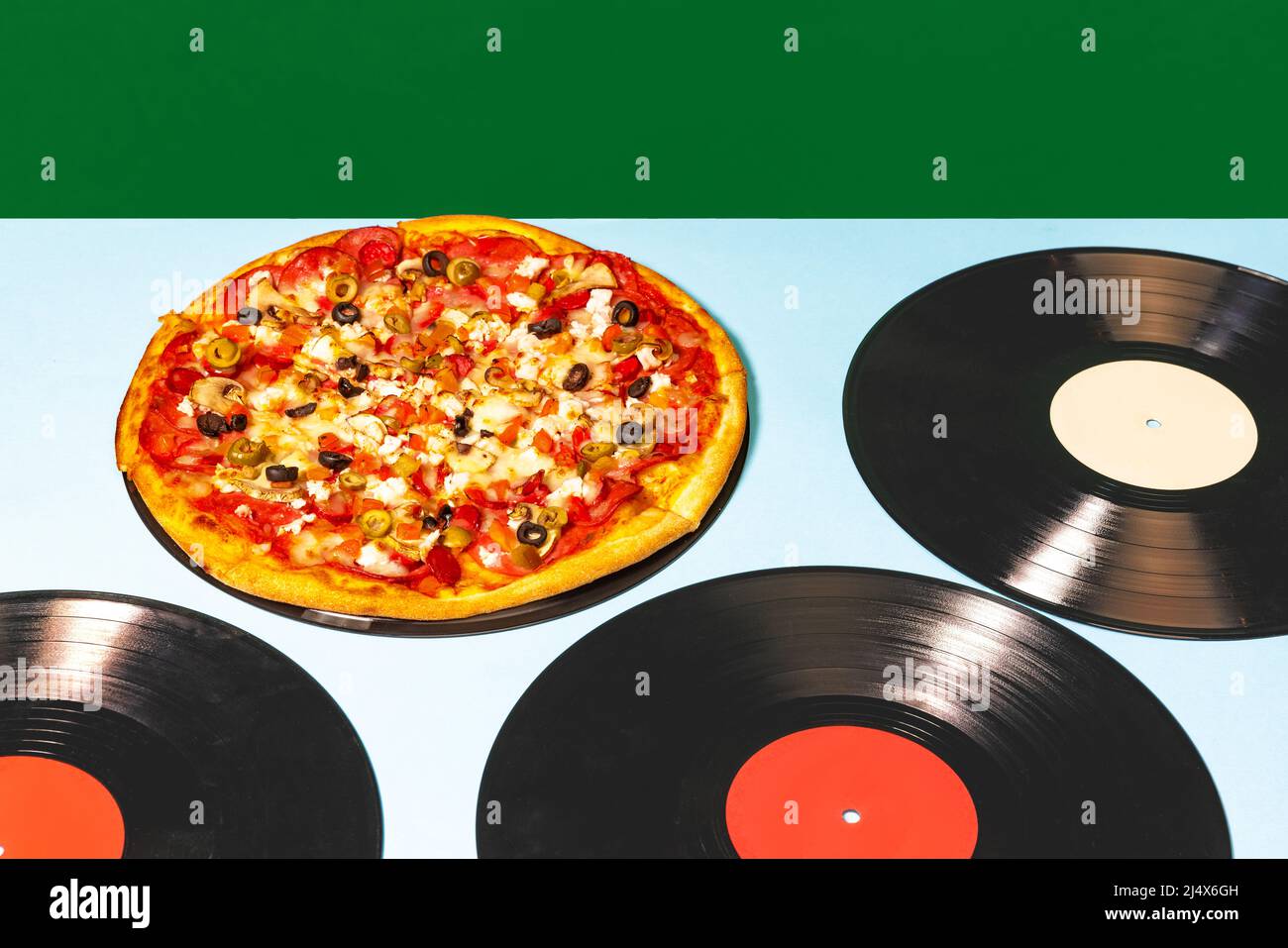 Food pop art photography. Italian pizza lying on vinyl discs on light ...