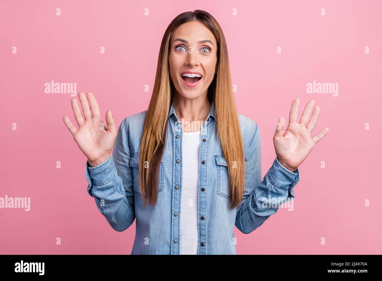 Photo of young cheerful woman glad content waving arms hi meet friends ...