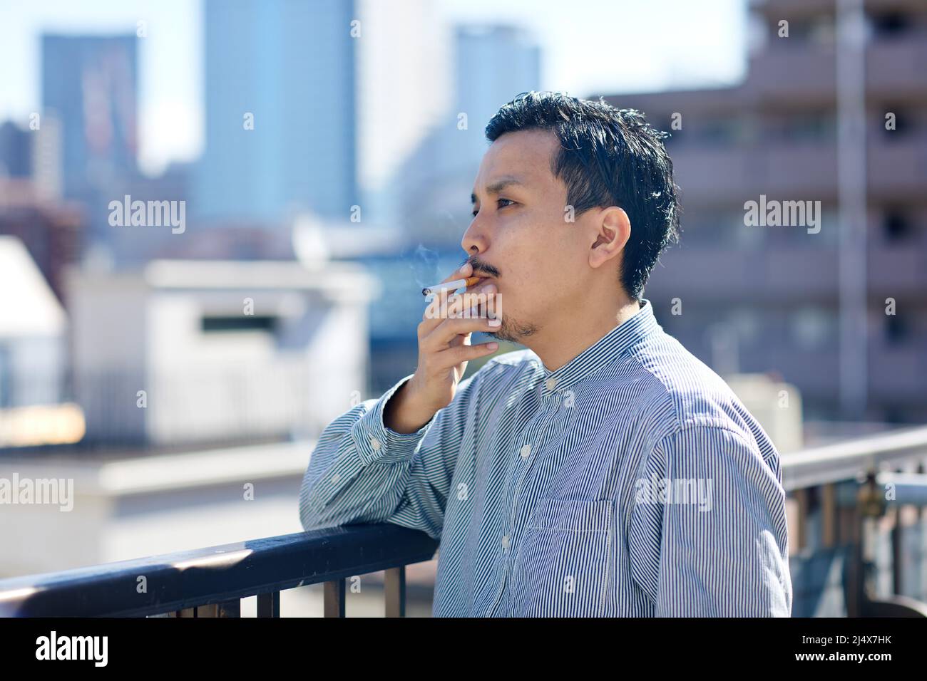 Side view man relaxing smoking hi-res stock photography and images - Alamy