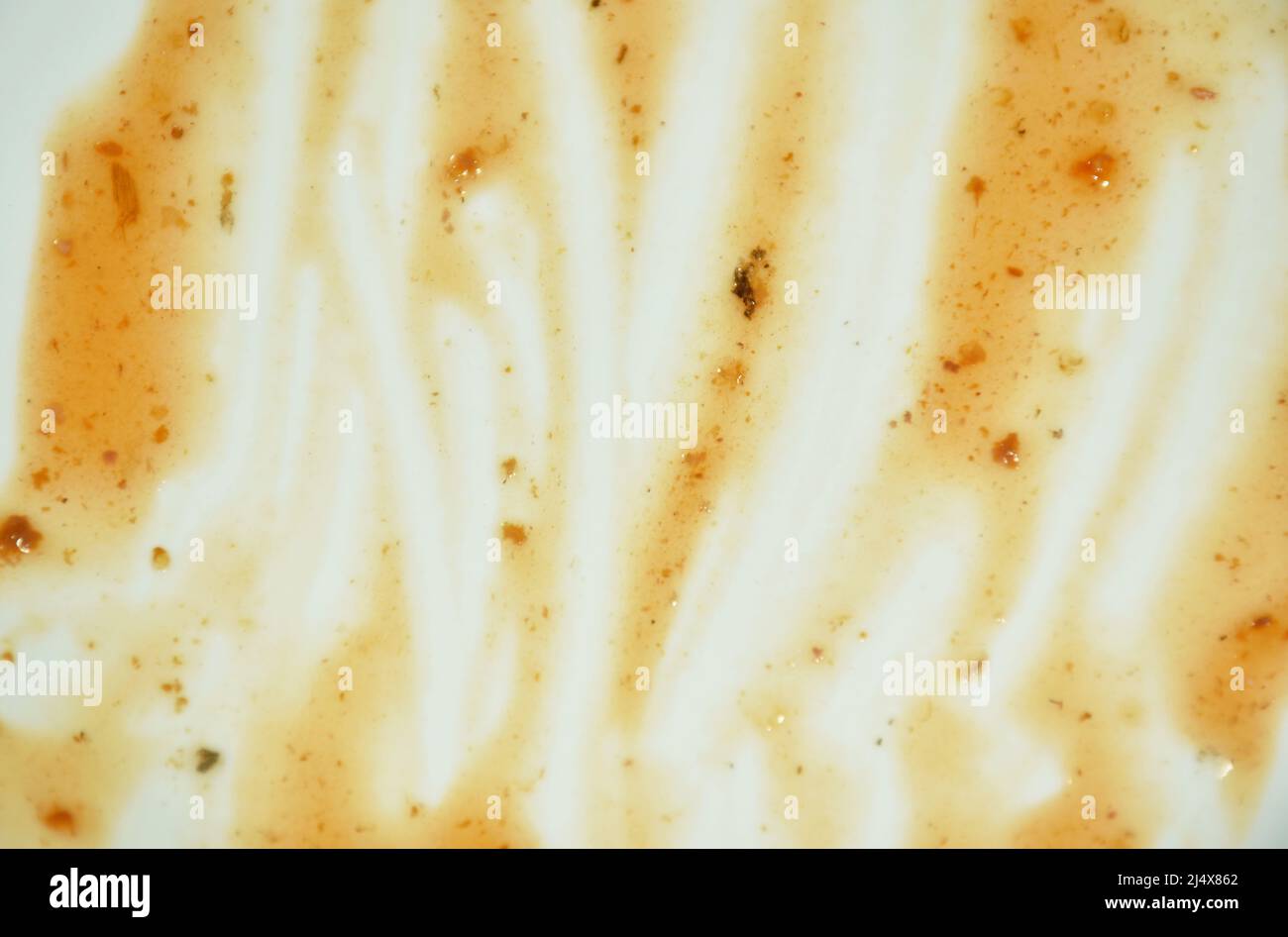 food stain left after eat on dish in white background Stock Photo - Alamy