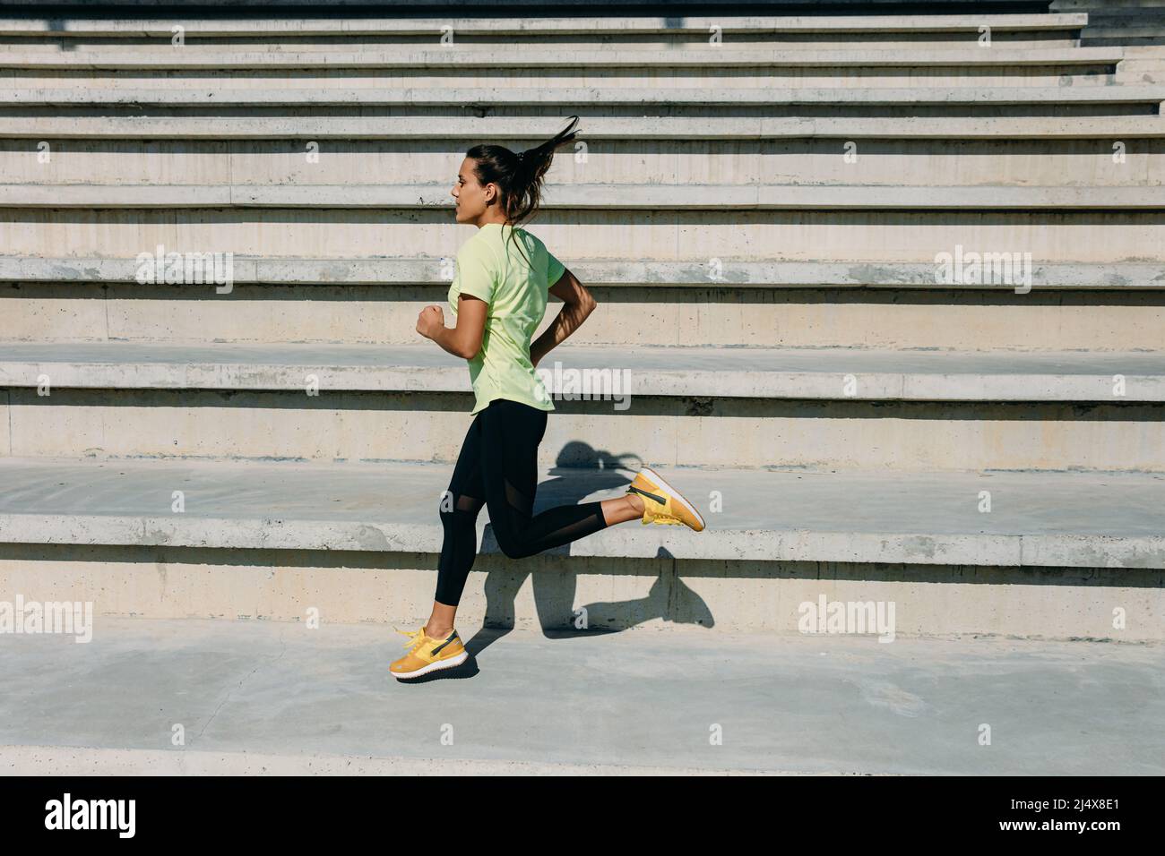 Young woman during workout stairs hi-res stock photography and images ...