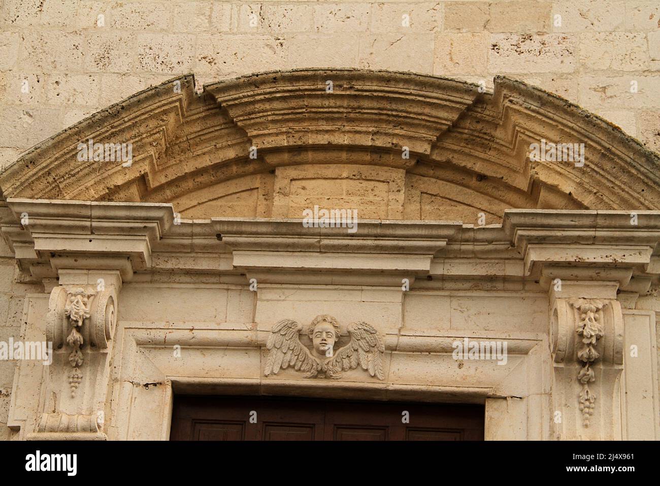 Beautiful pediment above entrance to an old building in Altamura, Italy ...