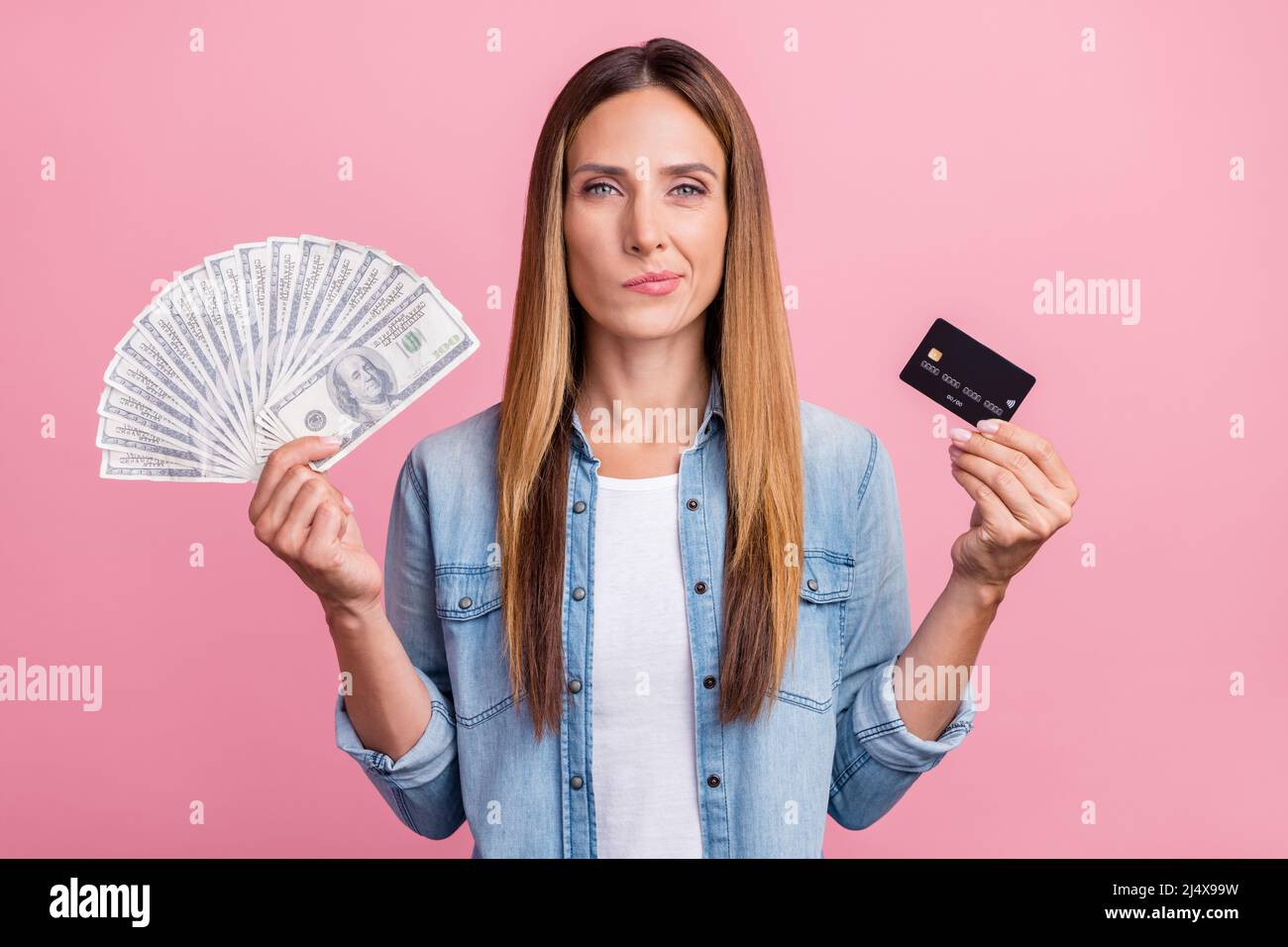 Photo of young lady hold bank card profit benefit thoughtful finance ...