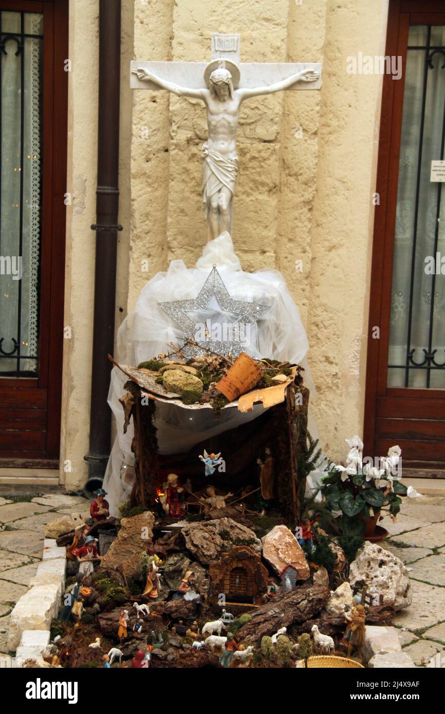Crucifix and Christmas Nativity scene in Italy Stock Photo - Alamy