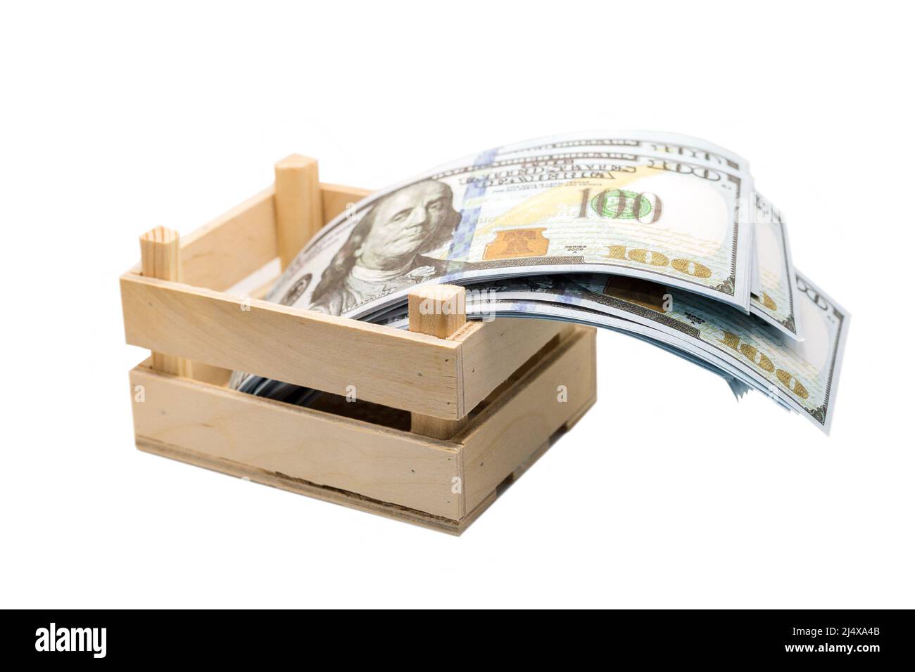 Paper money lies in a small wooden box, isolated, white background ...