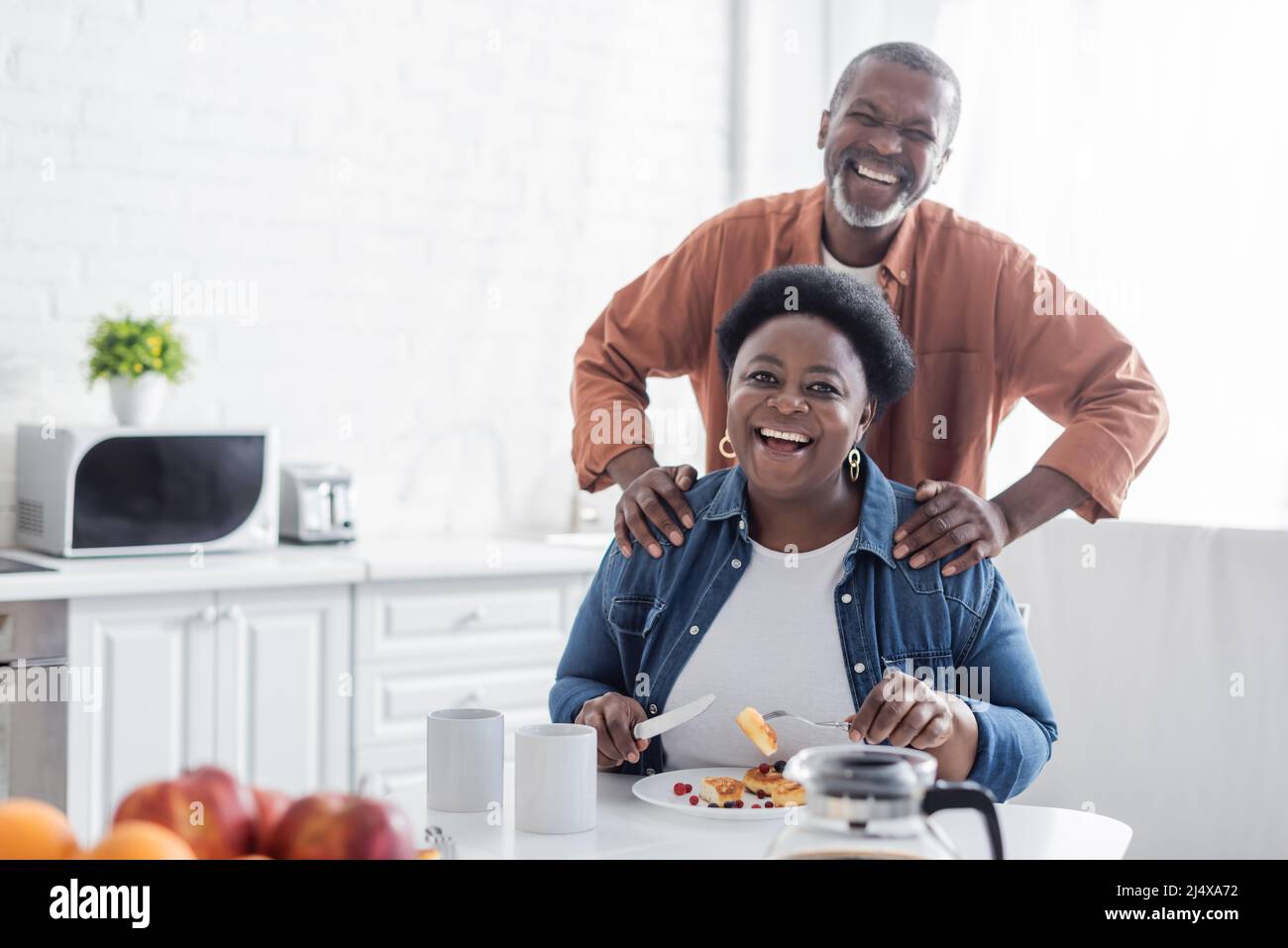 Man standing behind table hi-res stock photography and images - Alamy