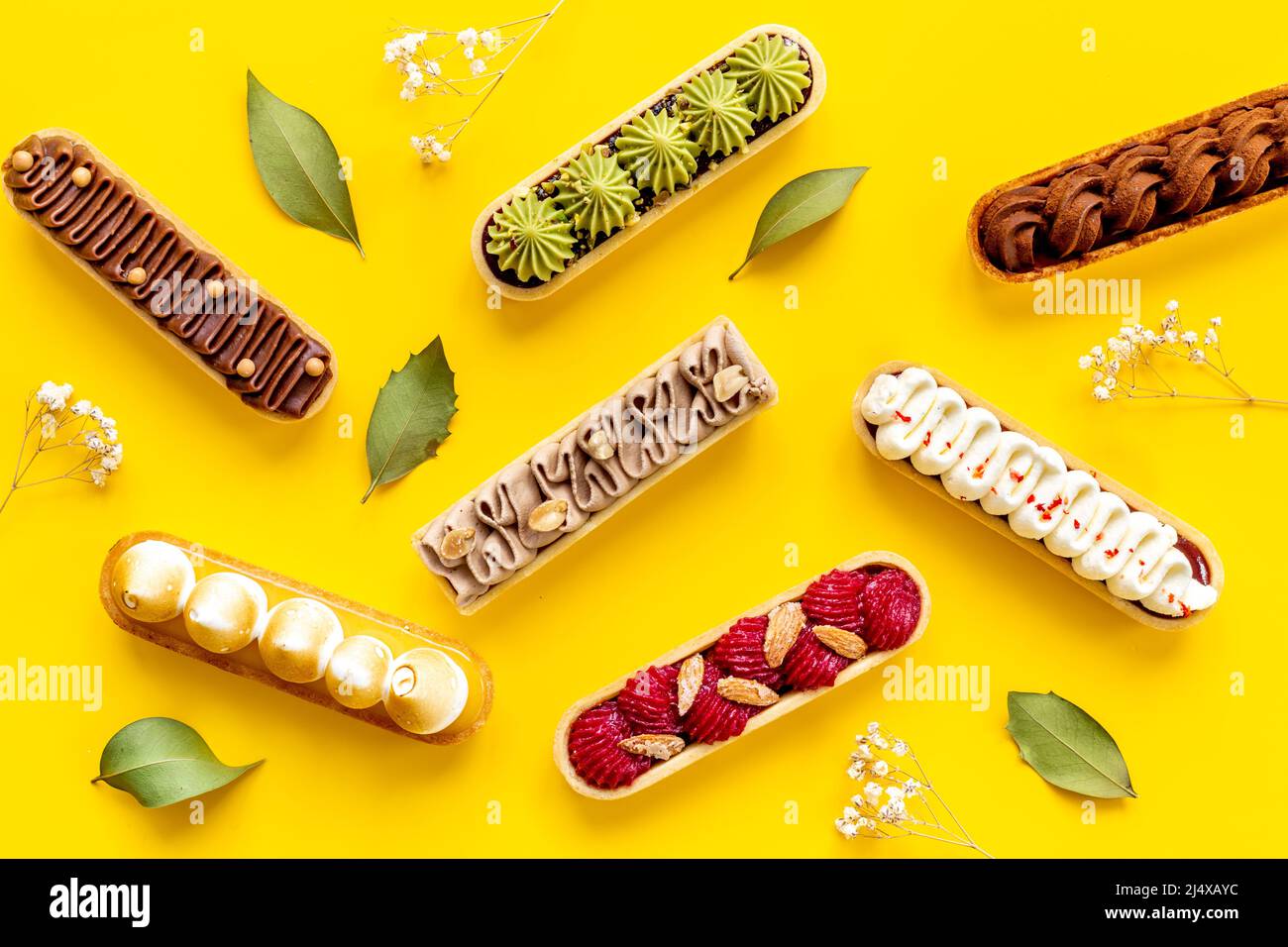 Set of french dessert eclairs with colorful topping Stock Photo - Alamy