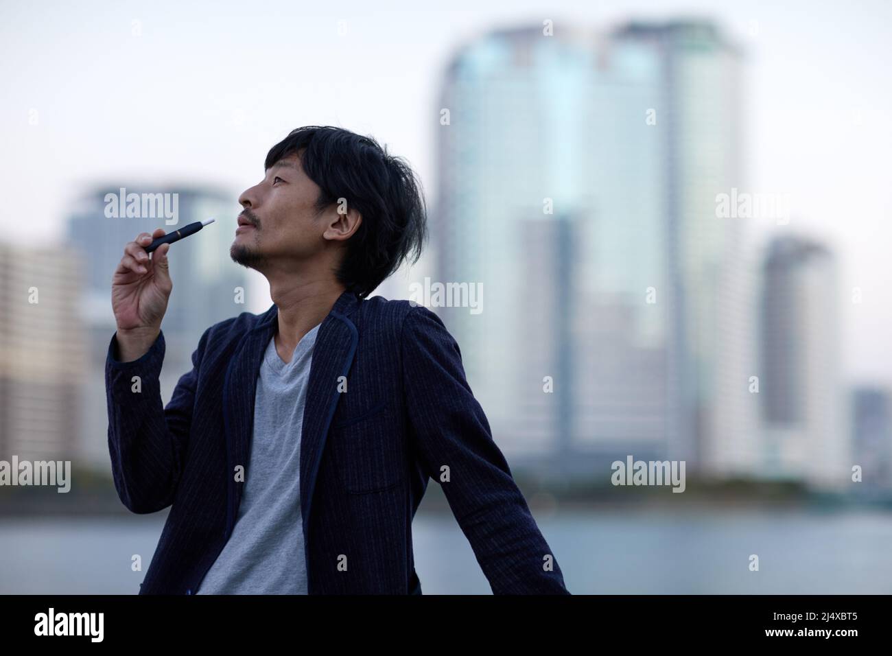 Middle aged man smoking cigarettes hi-res stock photography and images ...