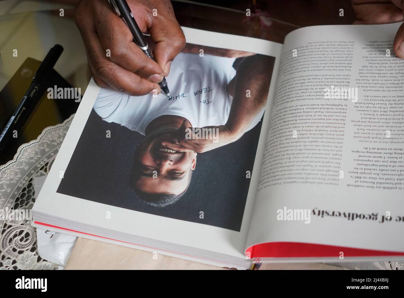 Kathmandu, Nepal. 18th Apr, 2022. MasterChef Santosh Shah signs a book ...