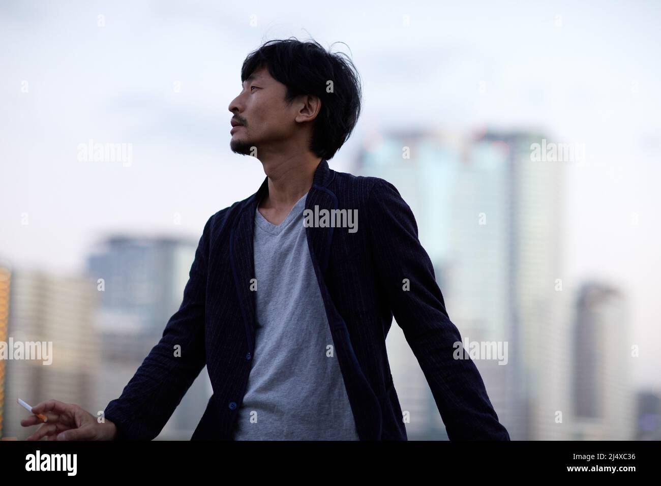 Side view man relaxing smoking hi-res stock photography and images - Alamy