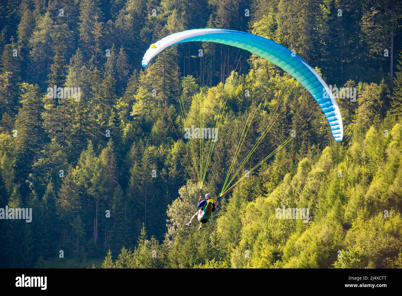 Paragliding flight in the austrian tyrol Stock Photo - Alamy