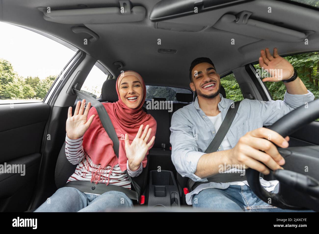 Happy Smiling Millennial Islamic Lady In Hijab And Man Singing Dancing