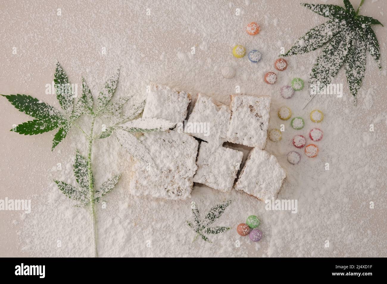 CBD sweets. Craft sweets with cannabis and powdered sugar on light ...