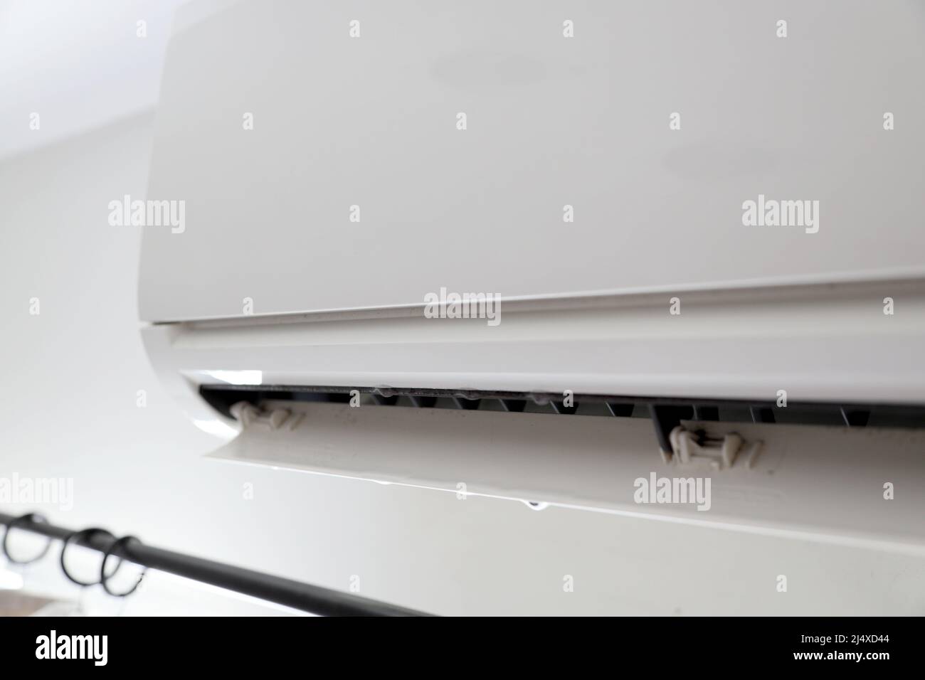 The liquid leaked from the broken air conditioner Stock Photo - Alamy
