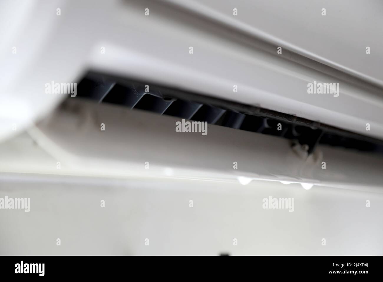 The liquid leaked from the broken air conditioner Stock Photo - Alamy