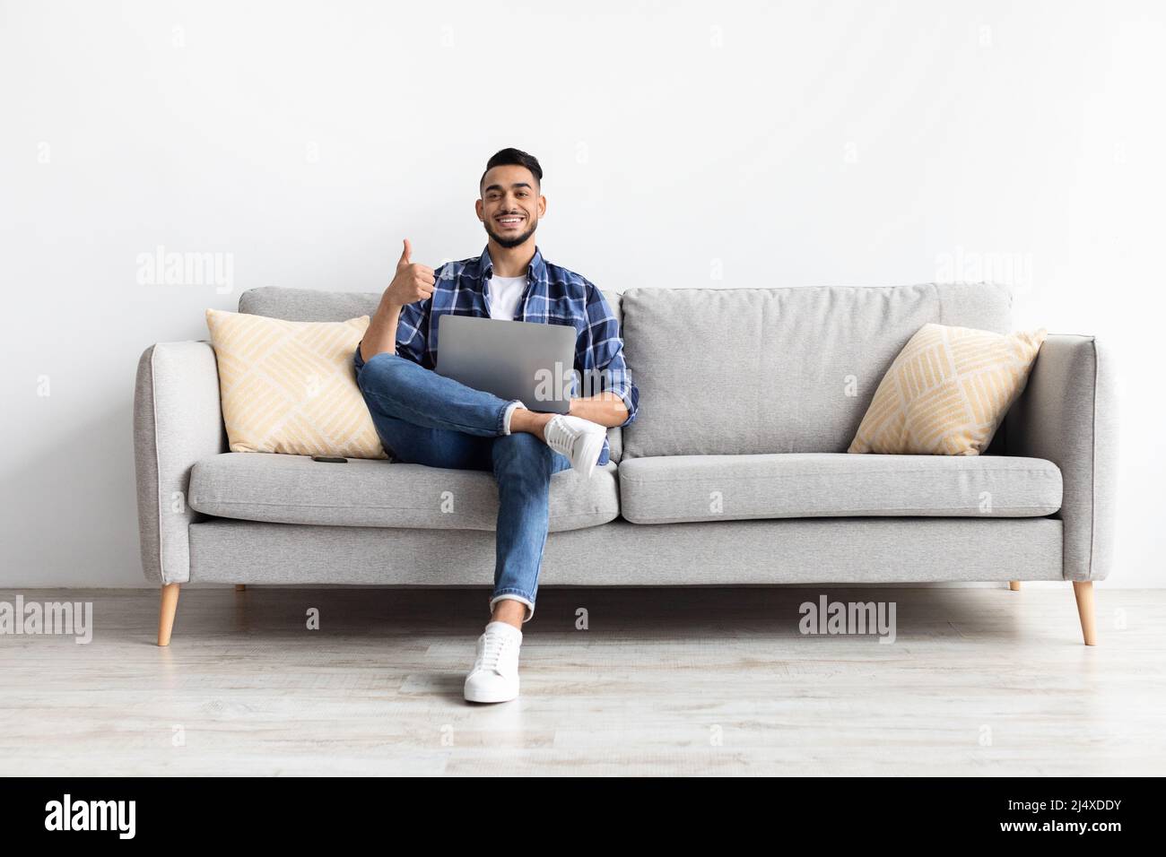 Thumbs up young man laptop hi-res stock photography and images - Alamy